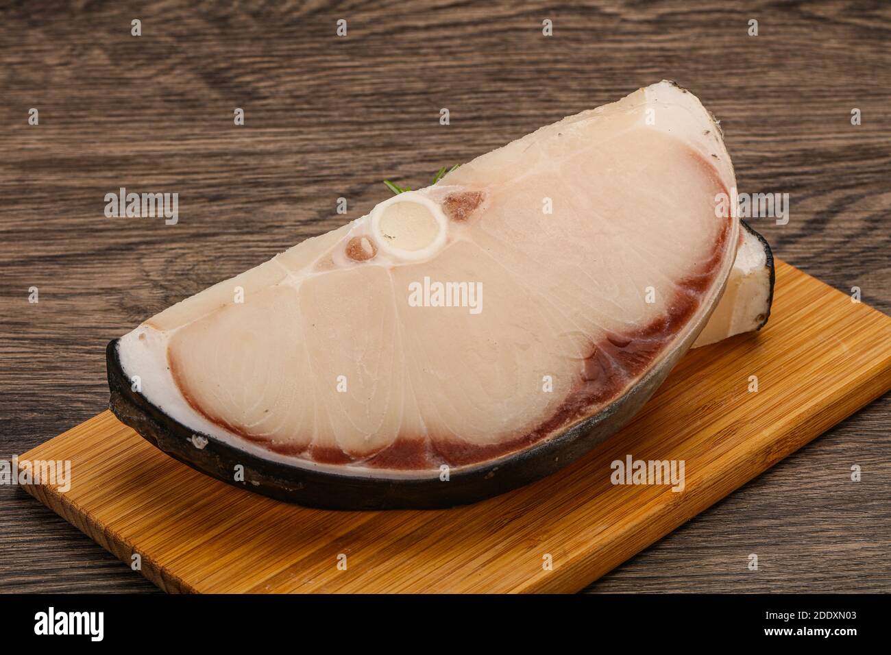 Raw shark steak served rosemary for cooking Stock Photo - Alamy