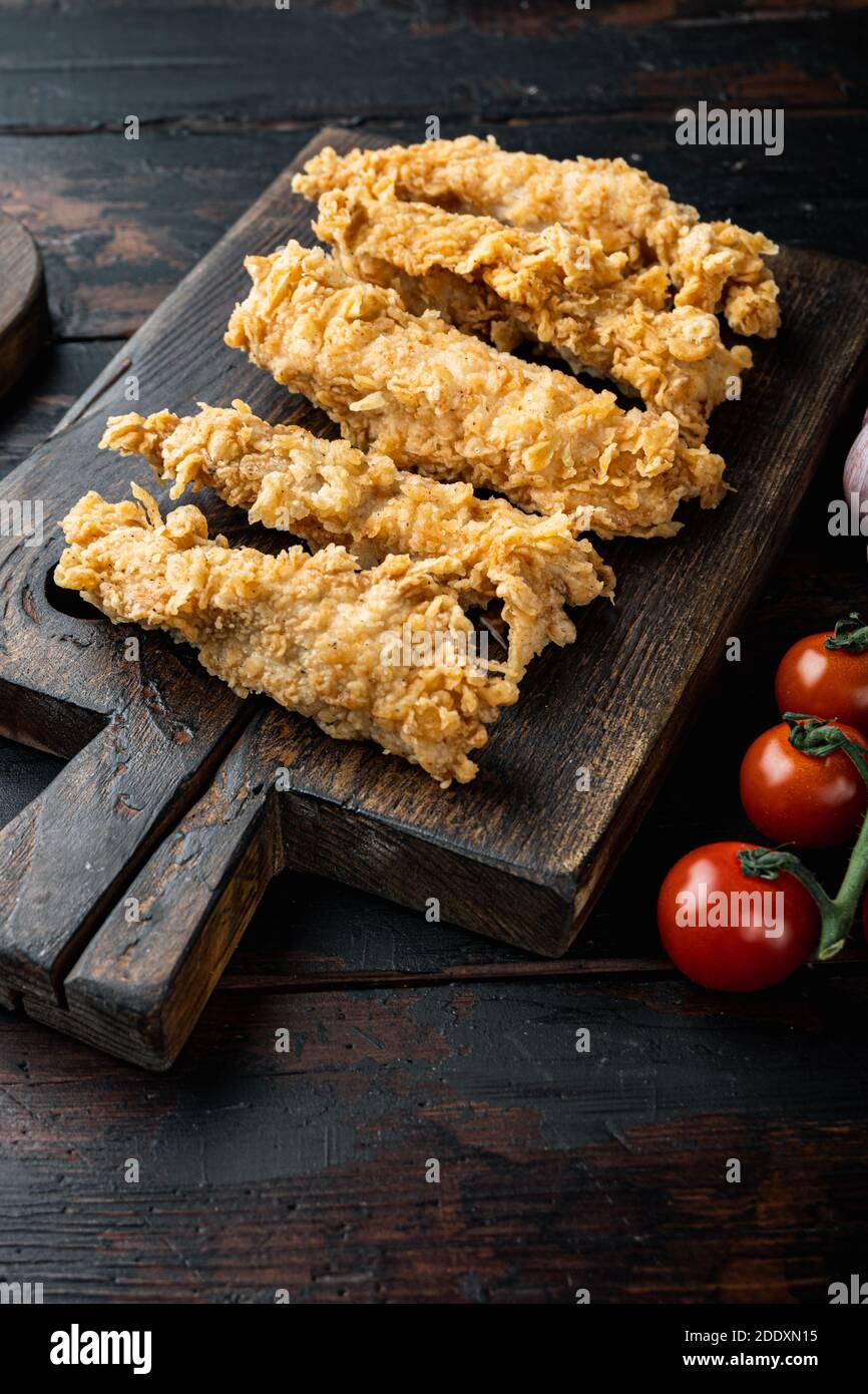Crispy fried chicken broast cuts on old dark wooden table Stock Photo ...