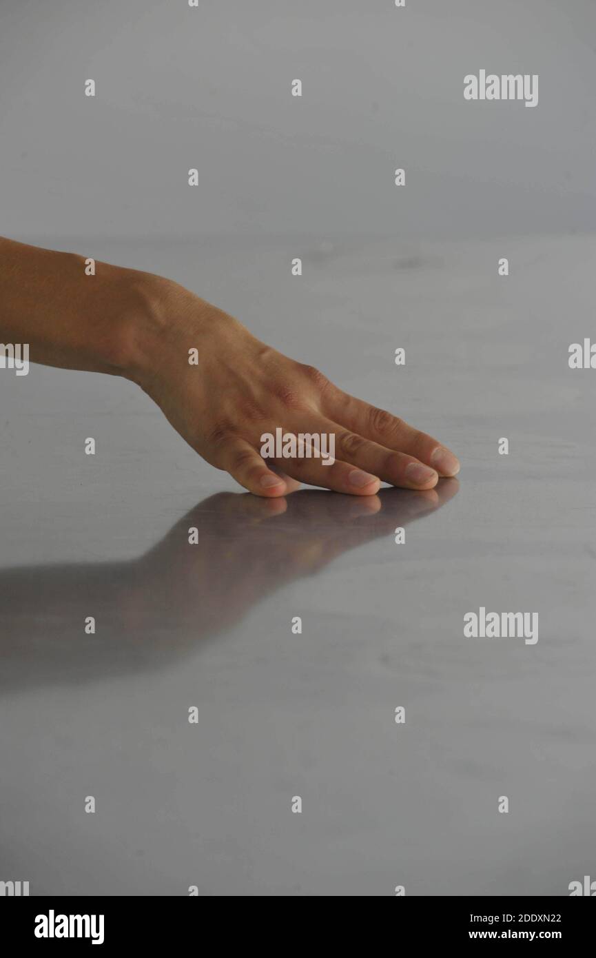 a hand touching reflecting floor, human tactile and haptic perception ...
