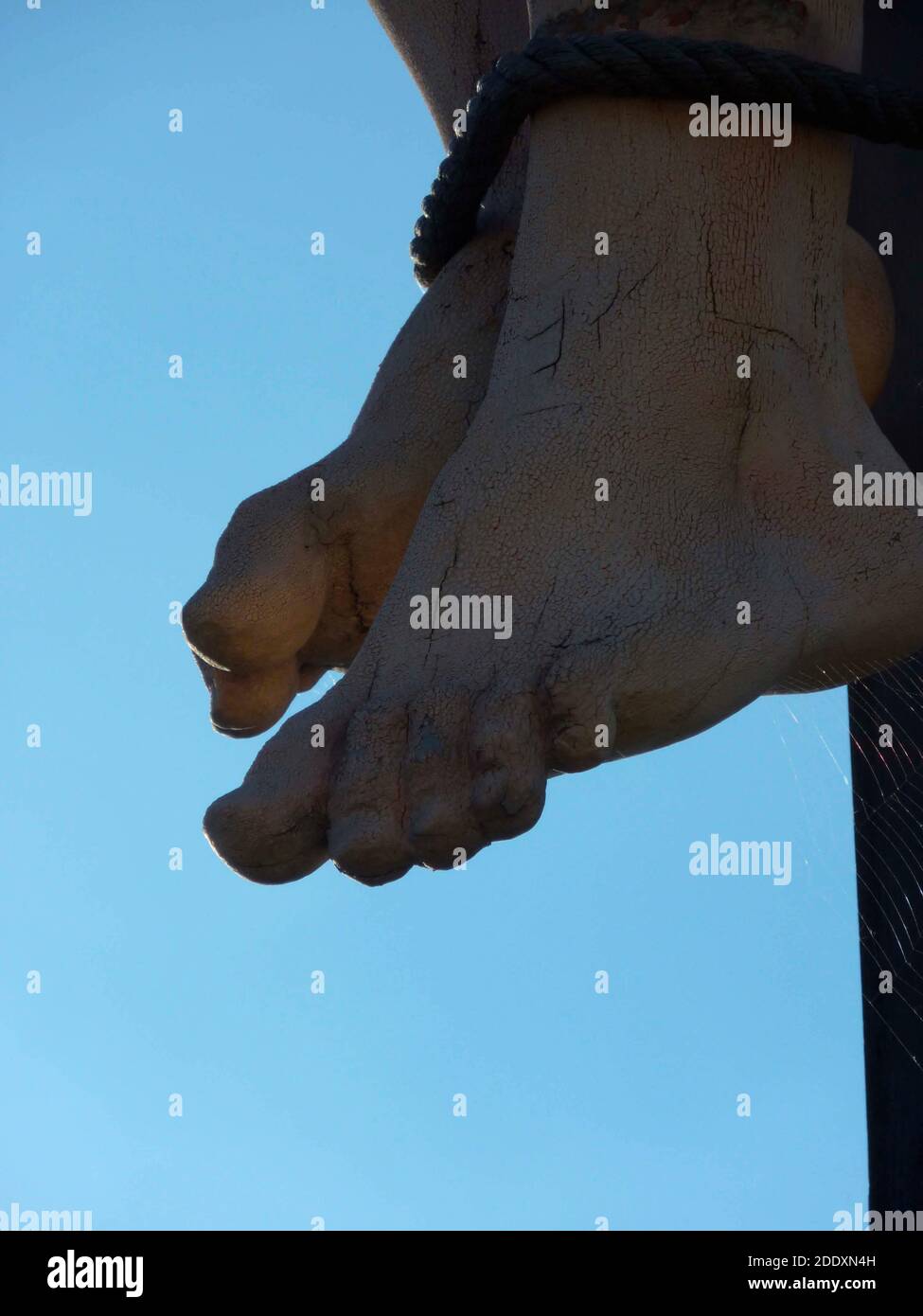 stone feet of a statue, barefoot, clear blue sky background Stock Photo ...