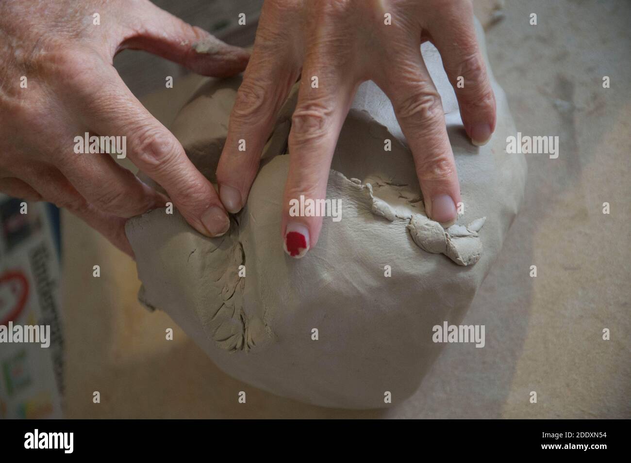 a hand touching a ball of clay, human tactile and haptic perception ...