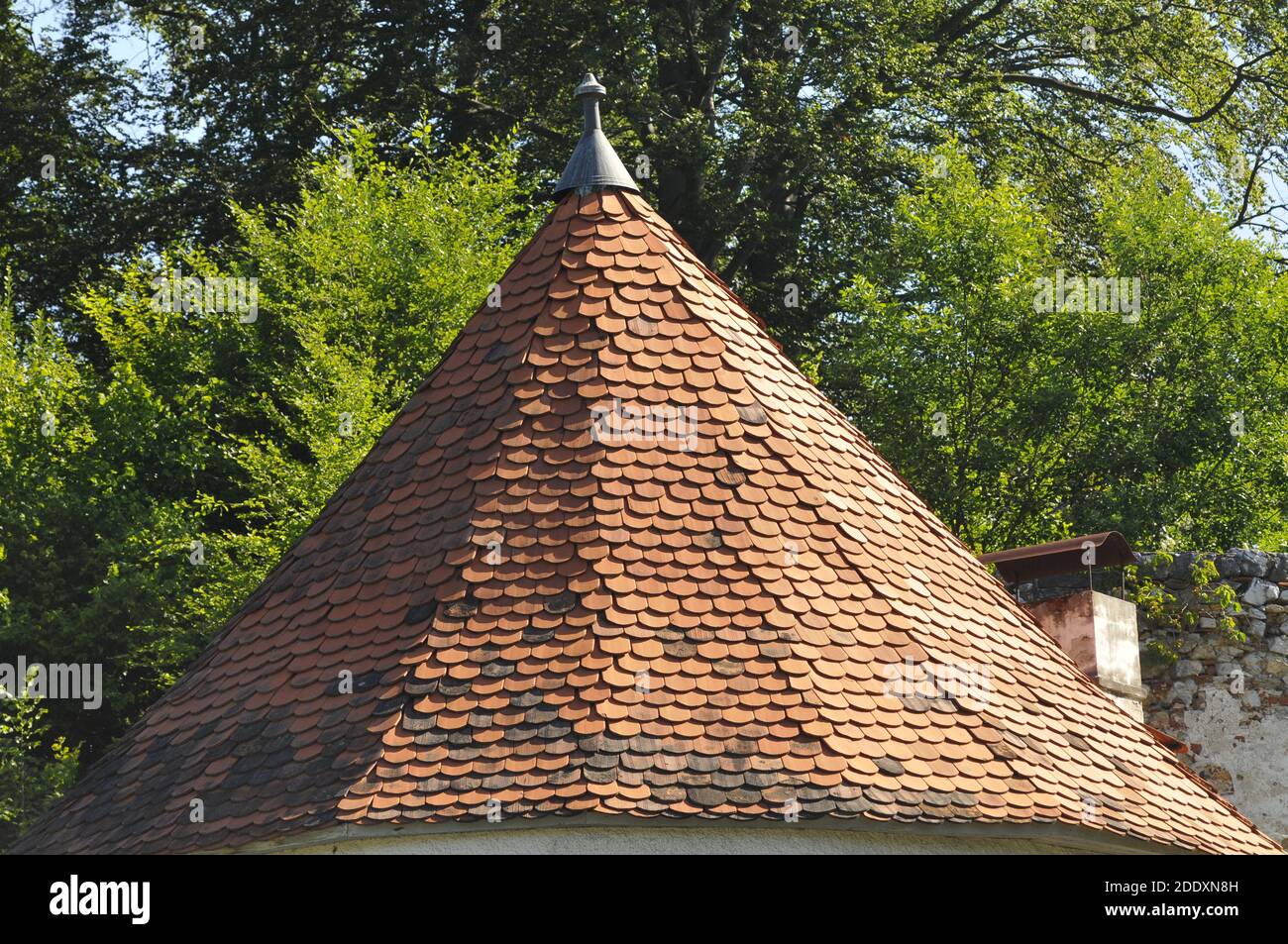 Roof tiles on a building, a round roof with lace Stock Photo - Alamy