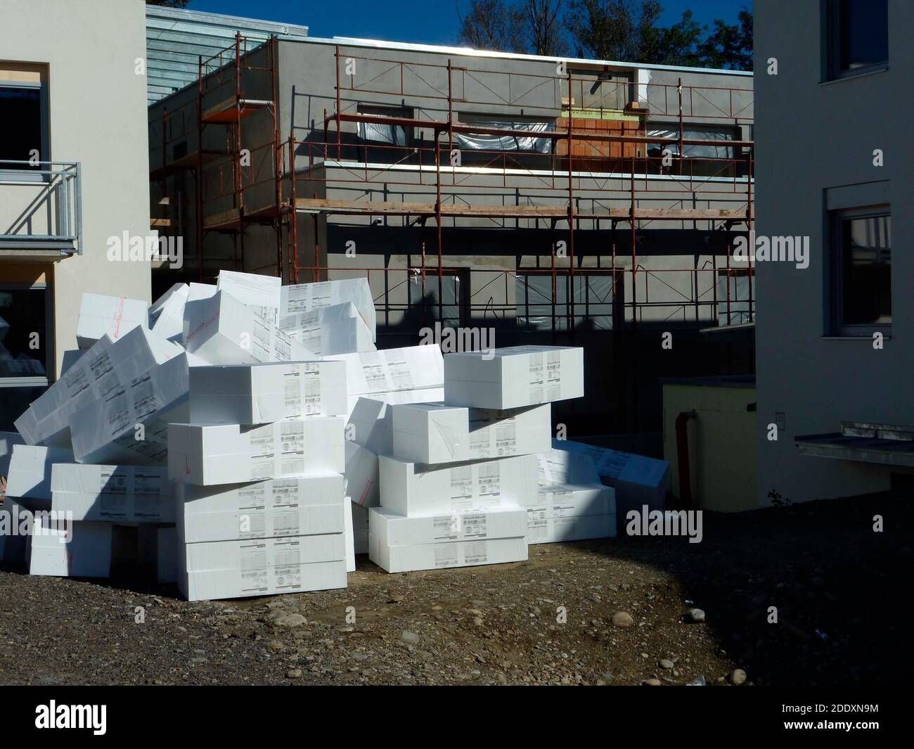 white unspoilt styrofoam boxes in front of a building for thermal ...