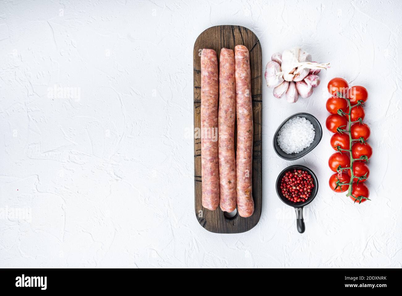 Traditional beef sausages, top view with space for text, on white ...