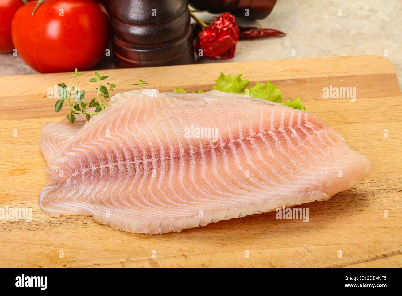 Raw tilapia fish fillet for cooking Stock Photo - Alamy