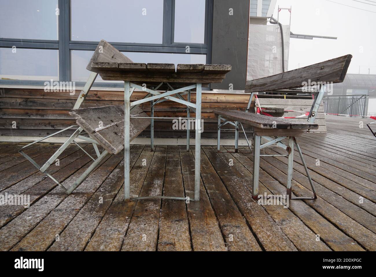 Wooden benches at closed restaurant due to shutdown Stock Photo - Alamy