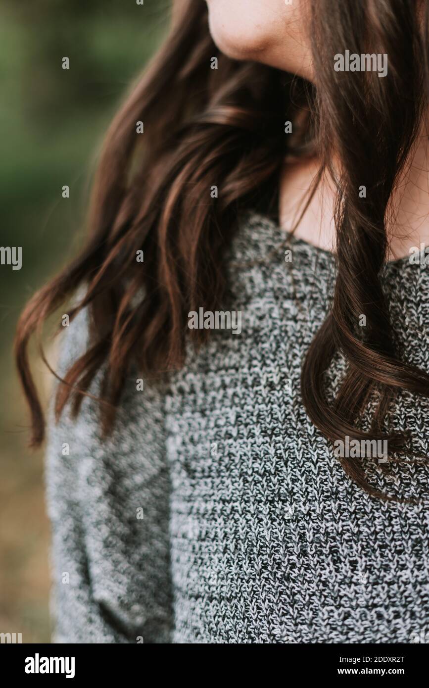 Portrait of a young adult girl on the background of a modern building ...