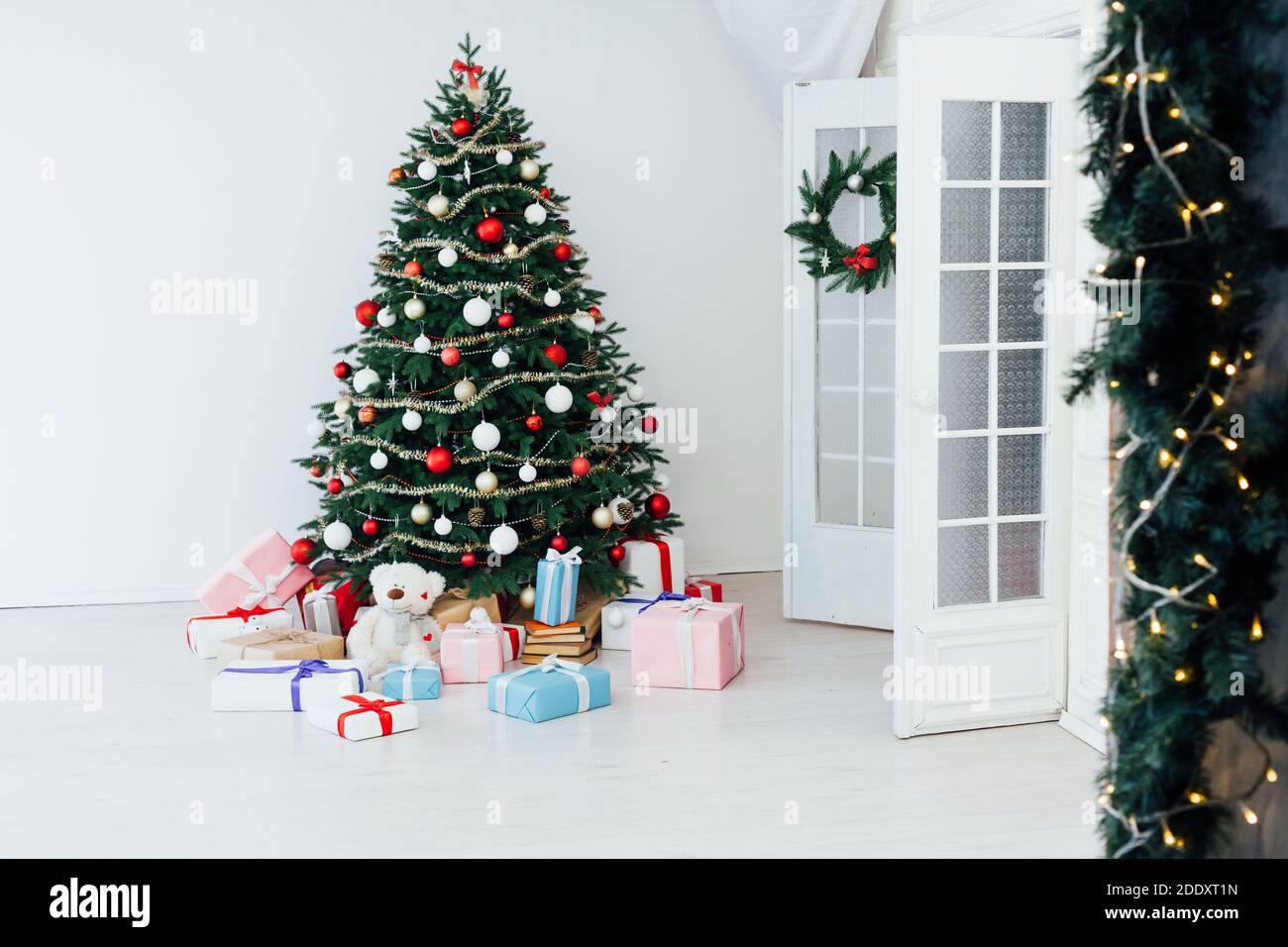 December Christmas tree pine with gifts new year interior decor Stock ...