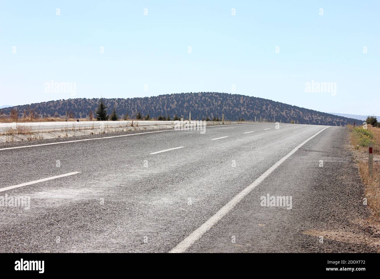 Empty asphalt country road with white lanes without any cars or traffic ...