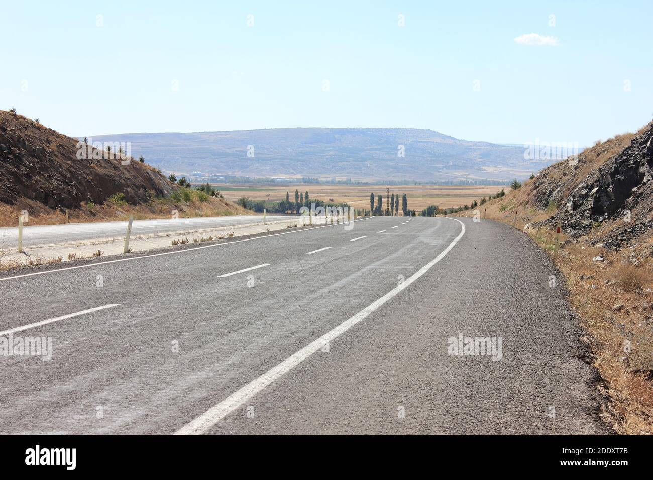 Empty asphalt country road with white lanes without any cars or traffic ...