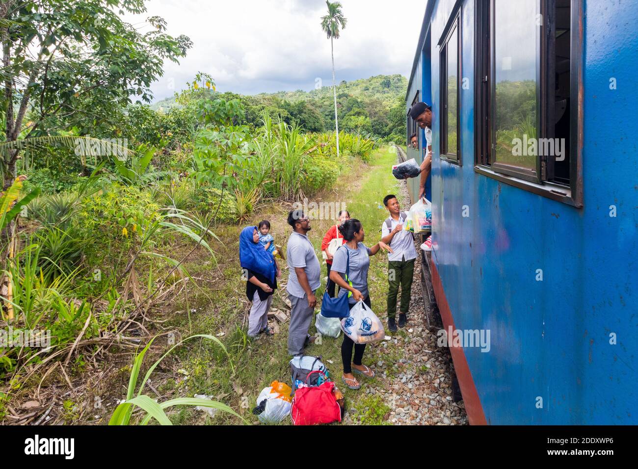 Passengers disembarking a train in Tenom, Sabah, Malaysia Stock Photo ...