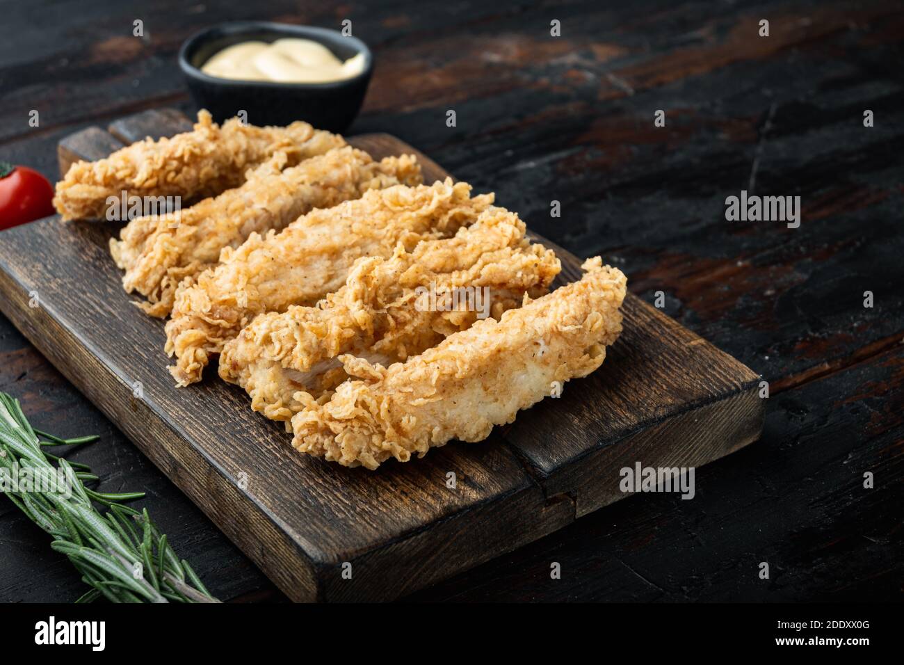 Chicken breaded wingshell meat on old dark wooden table, with copy ...
