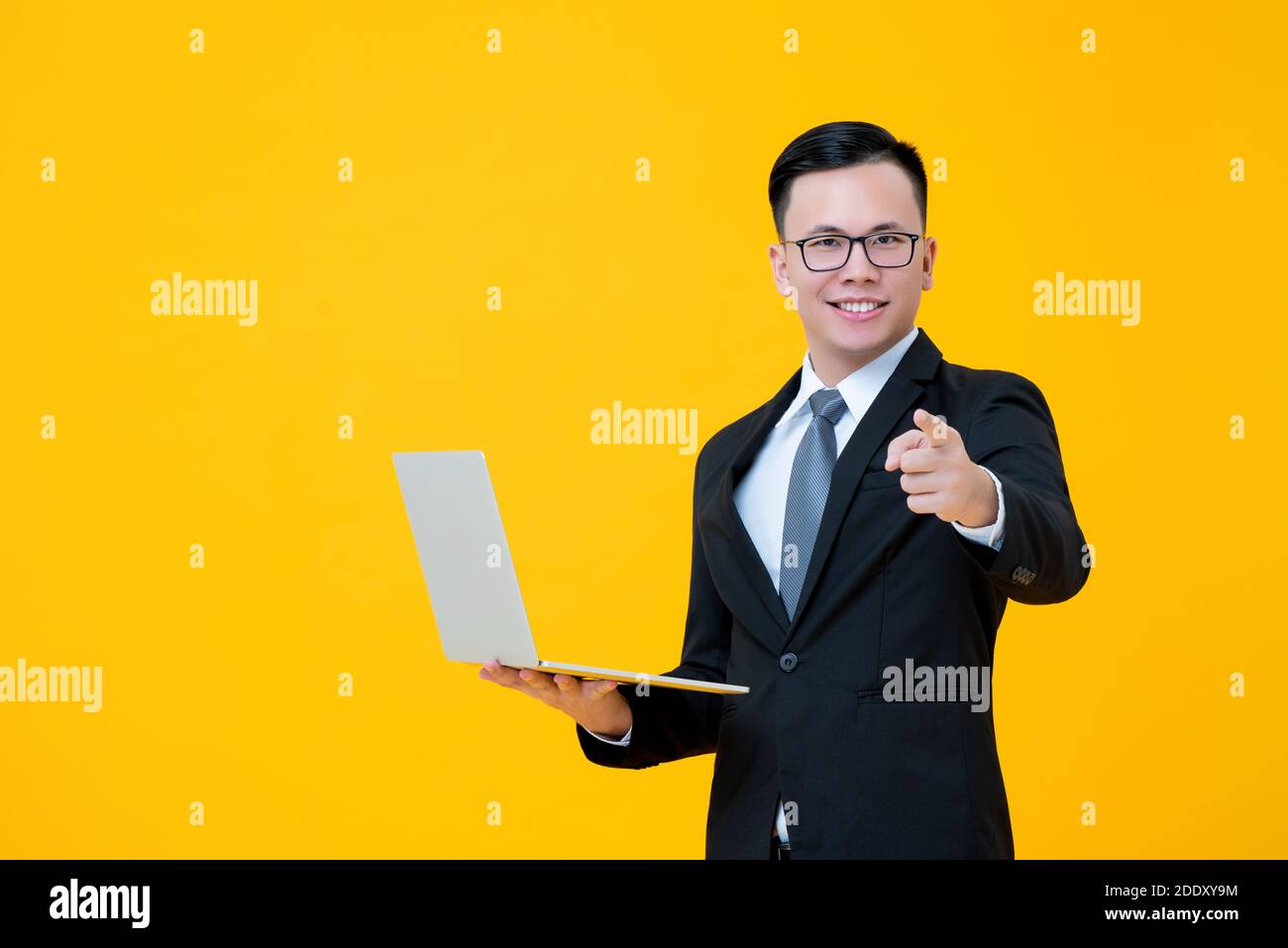 Young Asian businessman being happy with his online business carrying ...