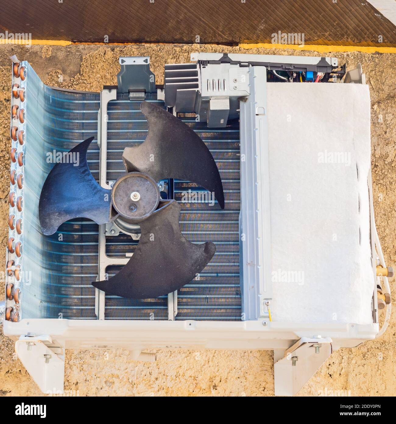 Fan in the compressor installation of an air conditioner hanging from ...