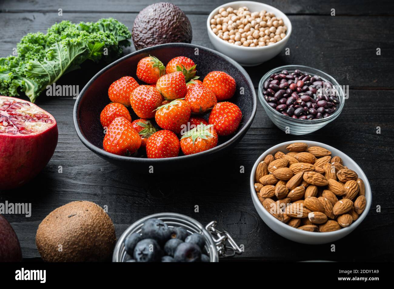 Healthy diet eating and meal planning, on black wooden background Stock ...