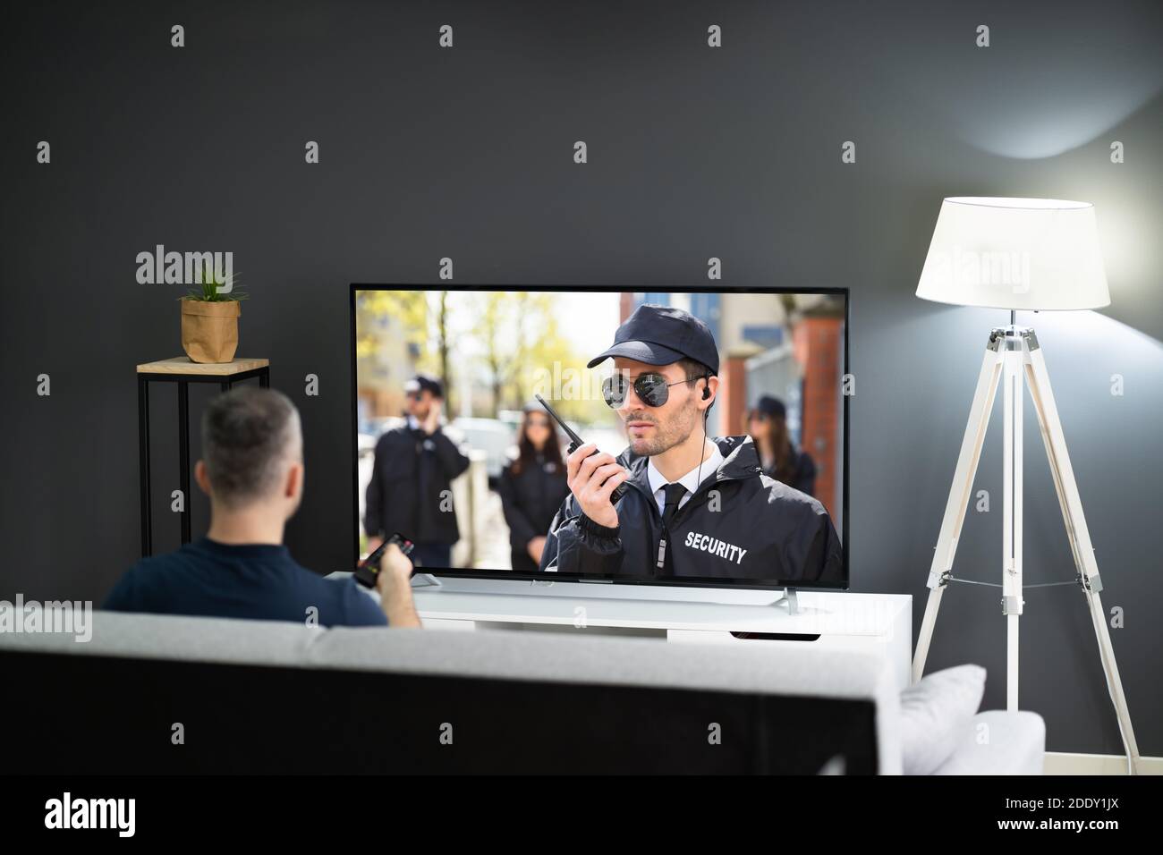 Man Streaming And Watching Movie On TV Screen Stock Photo - Alamy