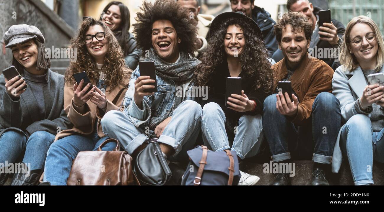 Young people using mobile smartphone outdoor - Millennial friends ...