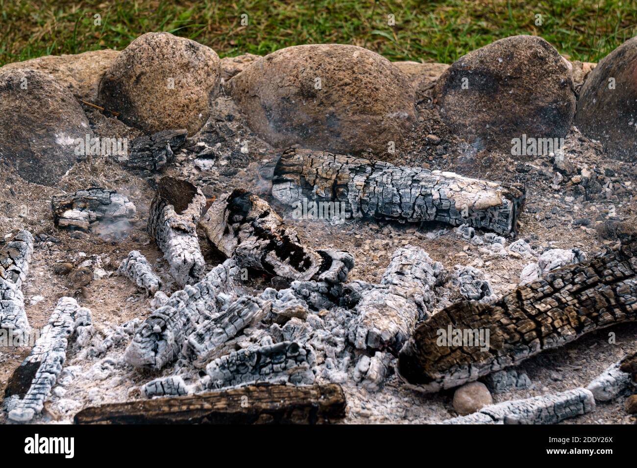 Remains of burnt wood in the fireplace Stock Photo - Alamy