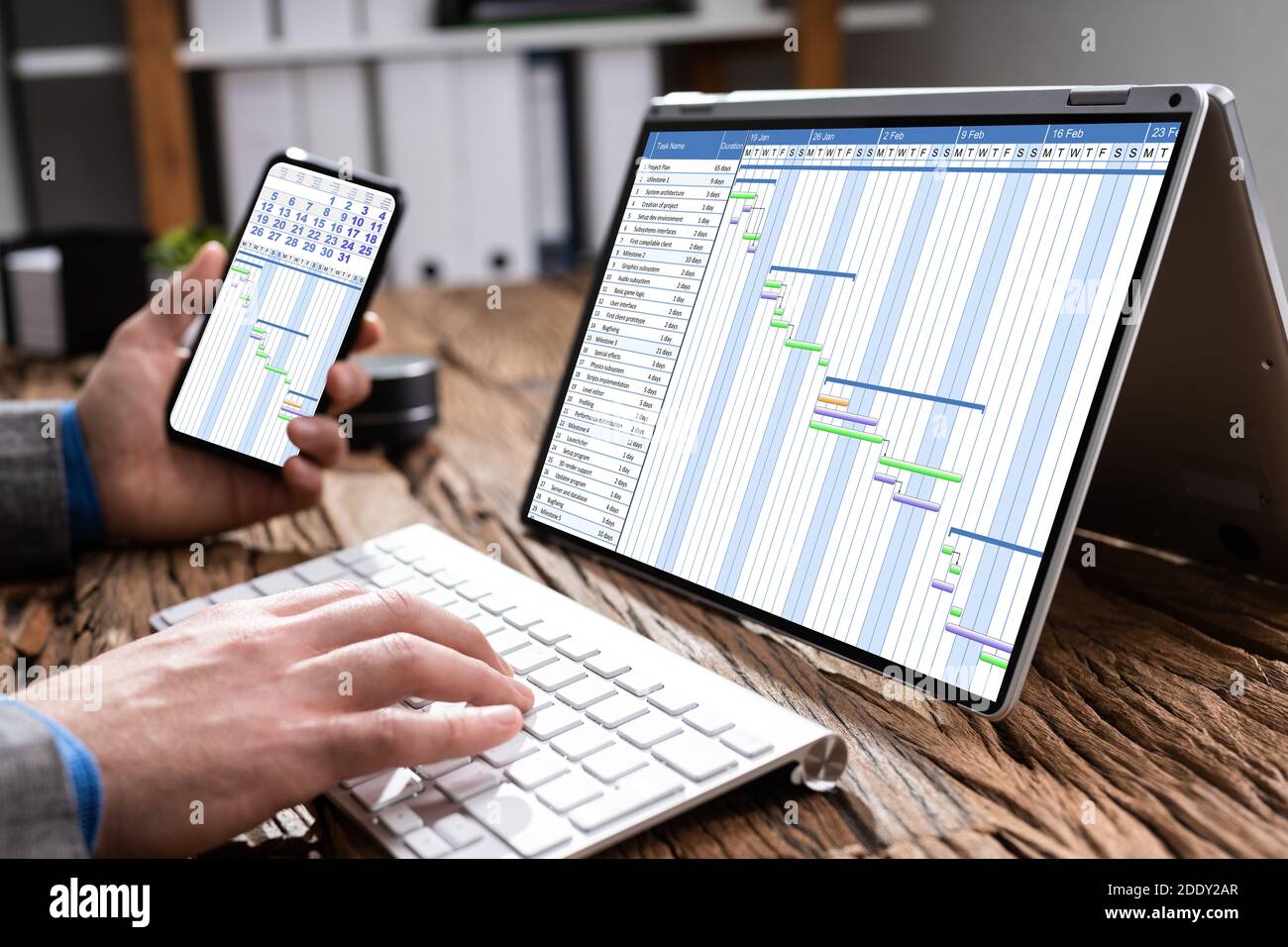 Gantt Chart And Time Sheet Scheduling Report On Screen Stock Photo - Alamy