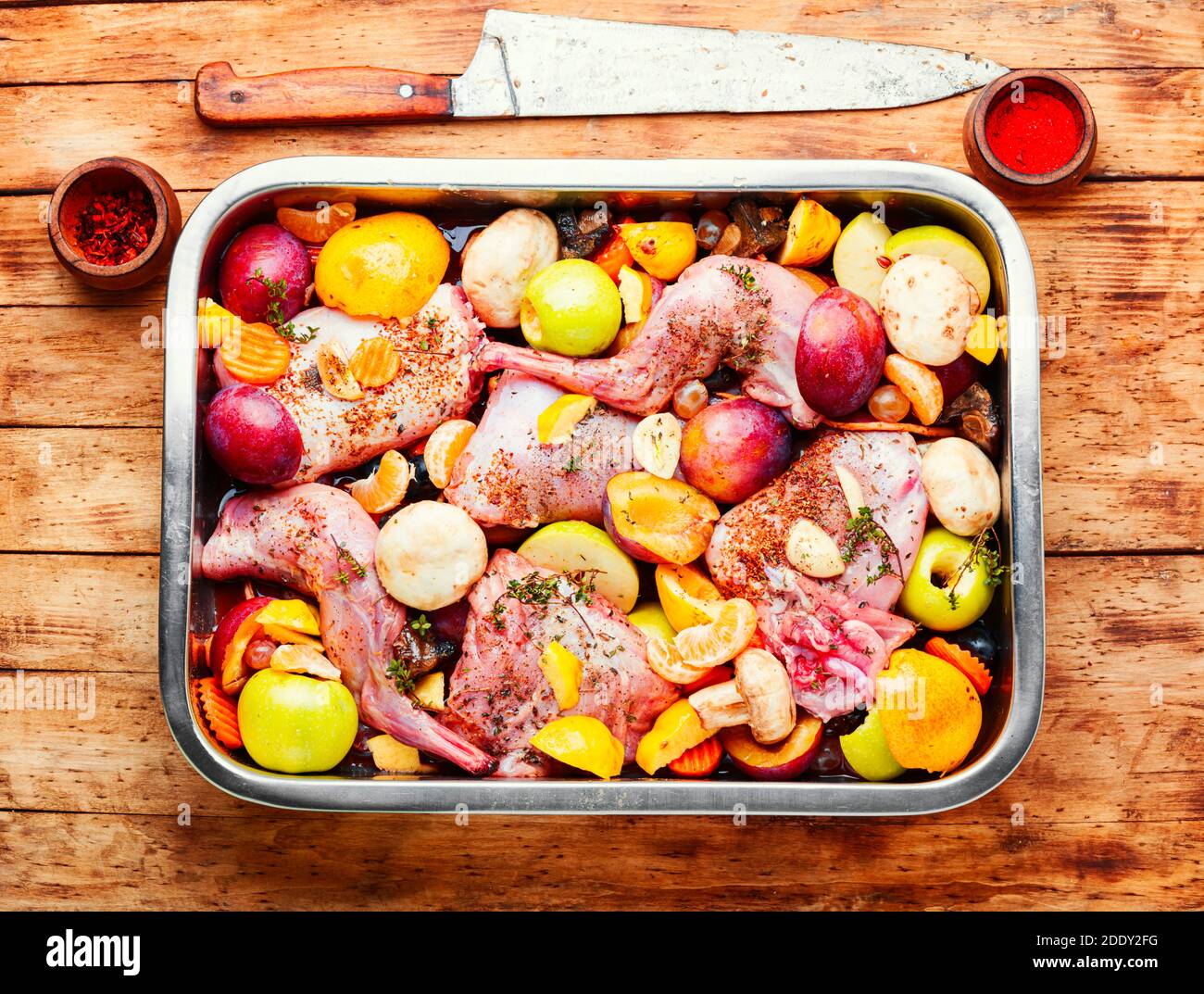 Pieces of raw rabbit meat marinated with fruit Stock Photo - Alamy