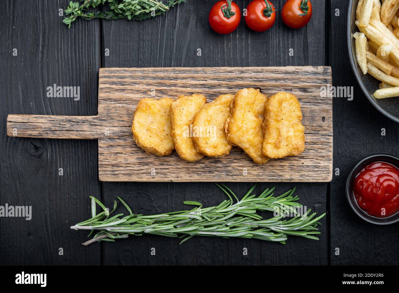 Homemade chicken nuggets fried on black wooden table, top view Stock ...
