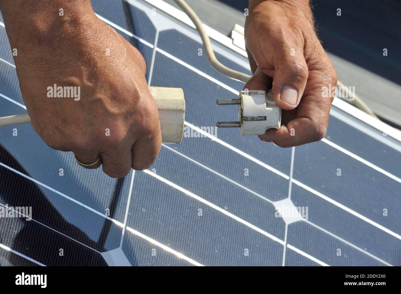 a power plug and solar panel, sustainable and ecological energy ...