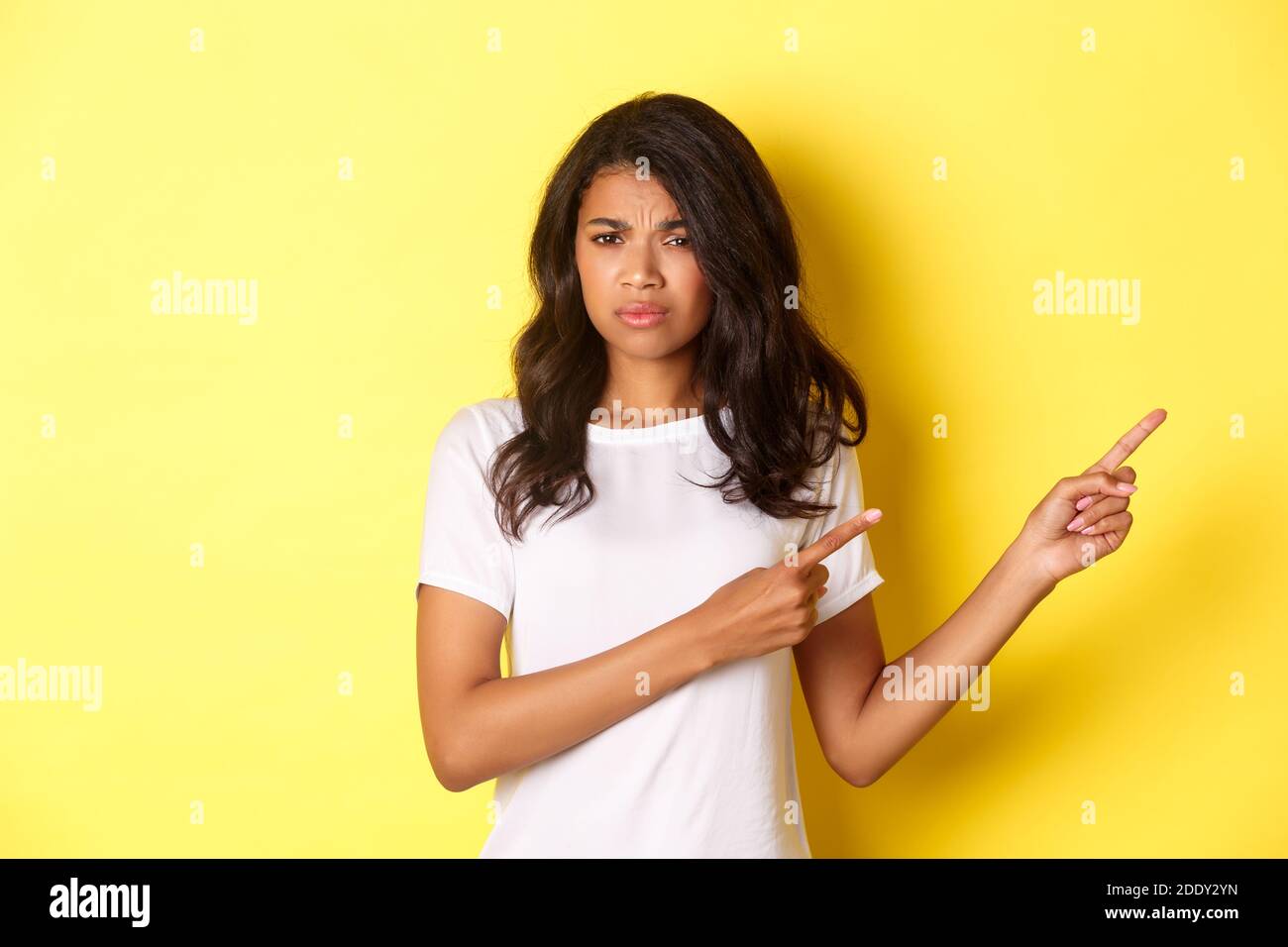 Portrait of skeptical and unamused african-american girl, judging ...