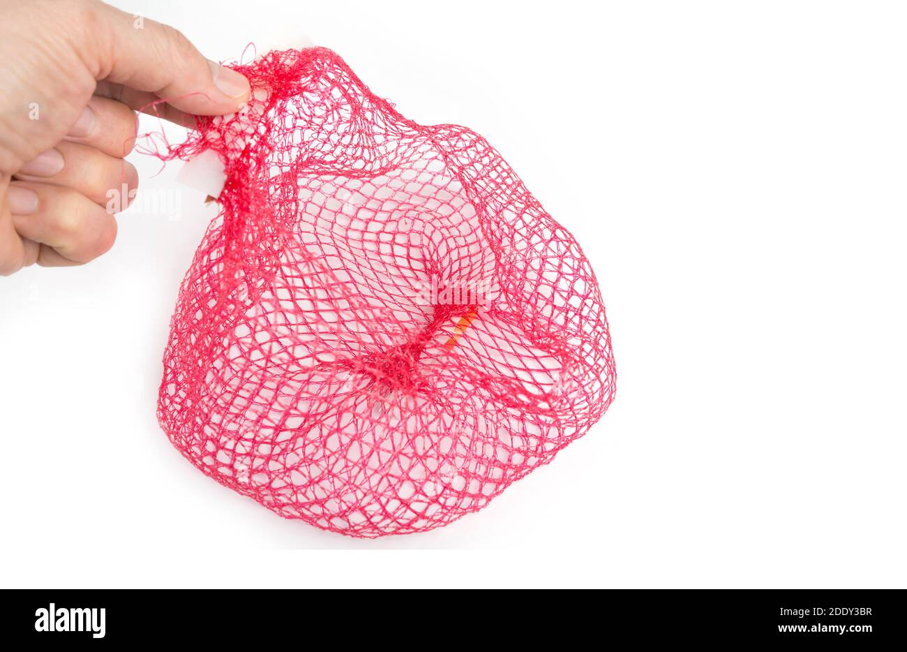 Empty mesh from fruit or vegetable on a white Stock Photo - Alamy
