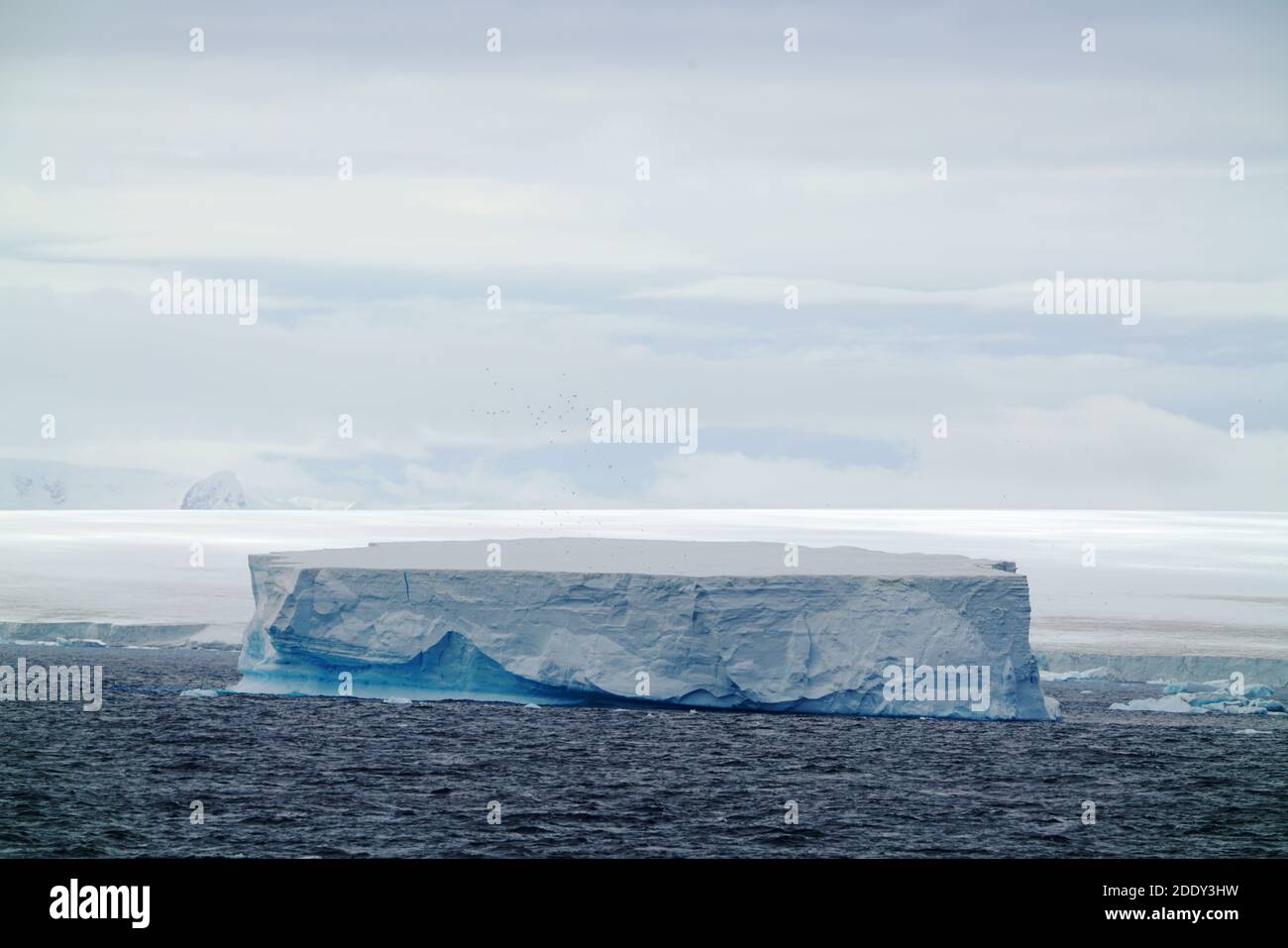 The iceberg is surrounded by the sea. The scenery seen during the ...