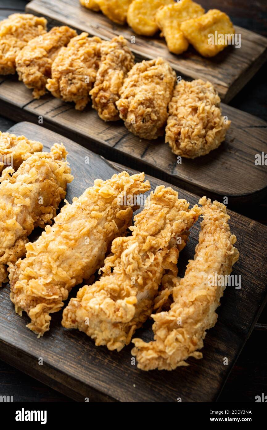 Southern fried chicken cuts on dark wooden background Stock Photo - Alamy
