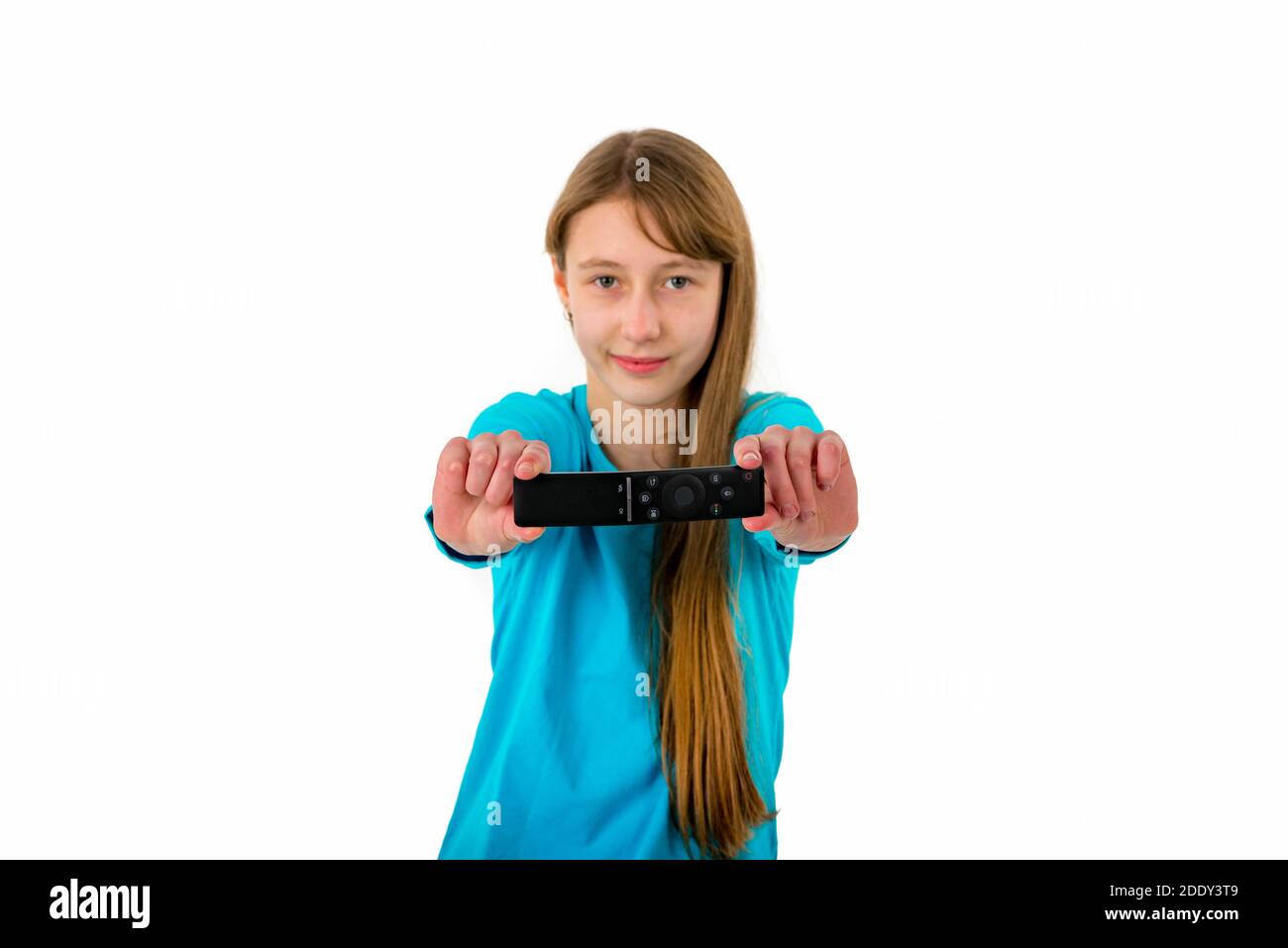 Girl kid child holds tv remote control.White studio wall.Closeup Stock ...