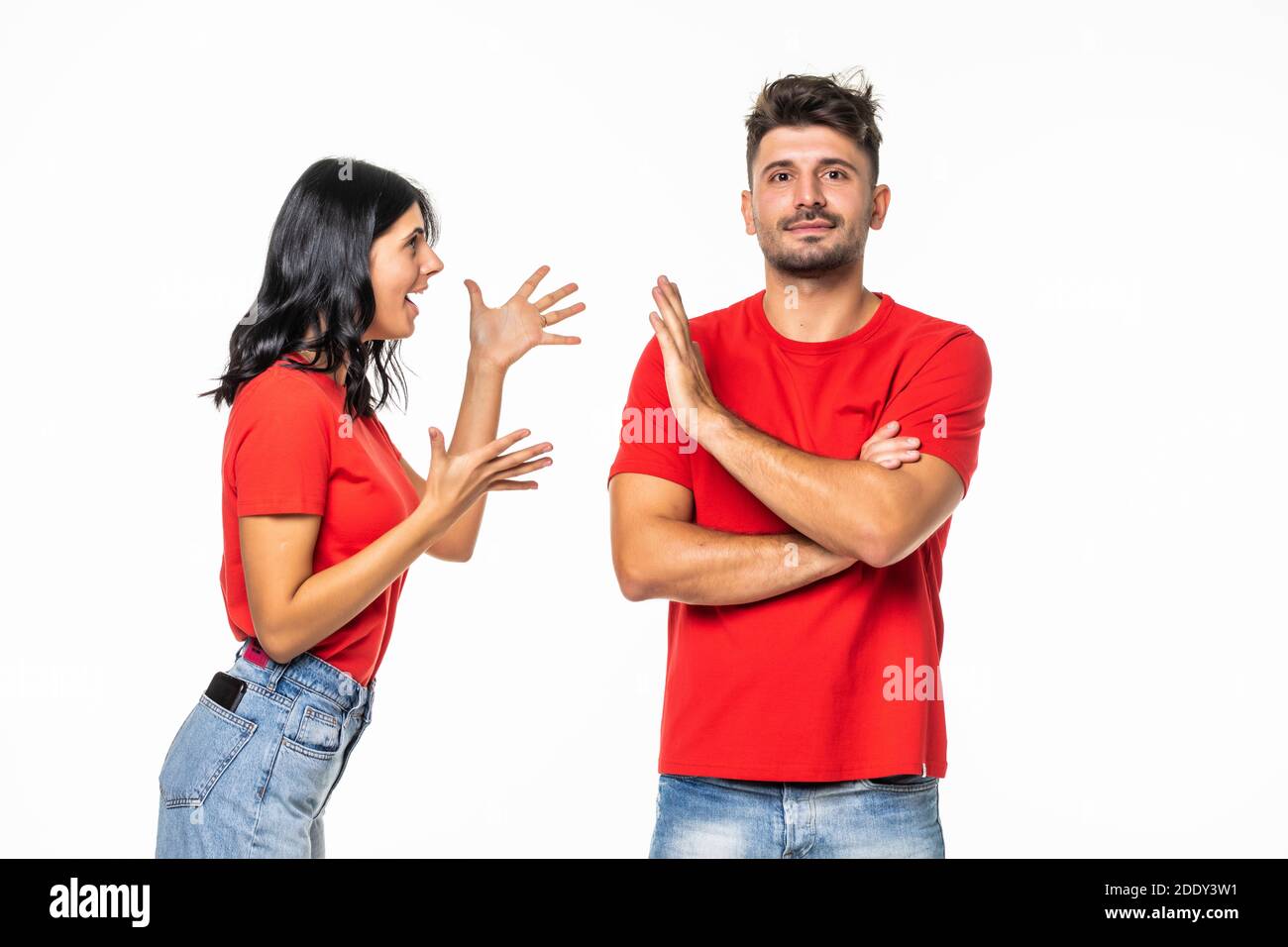 Angry couple shouting at each other on white background Stock Photo - Alamy