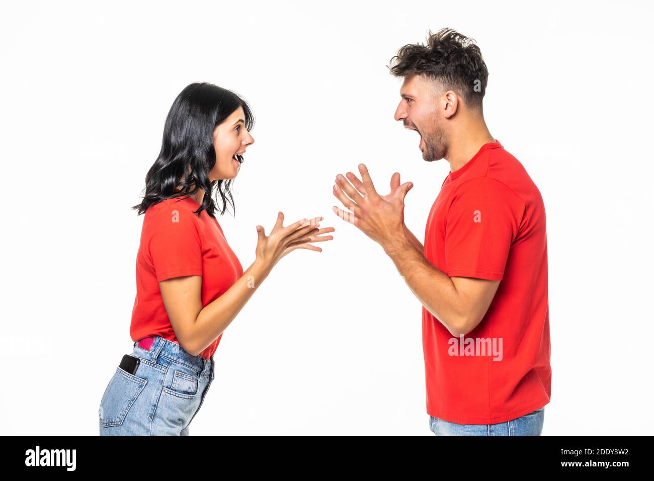 Angry couple shouting at each other on white background Stock Photo - Alamy
