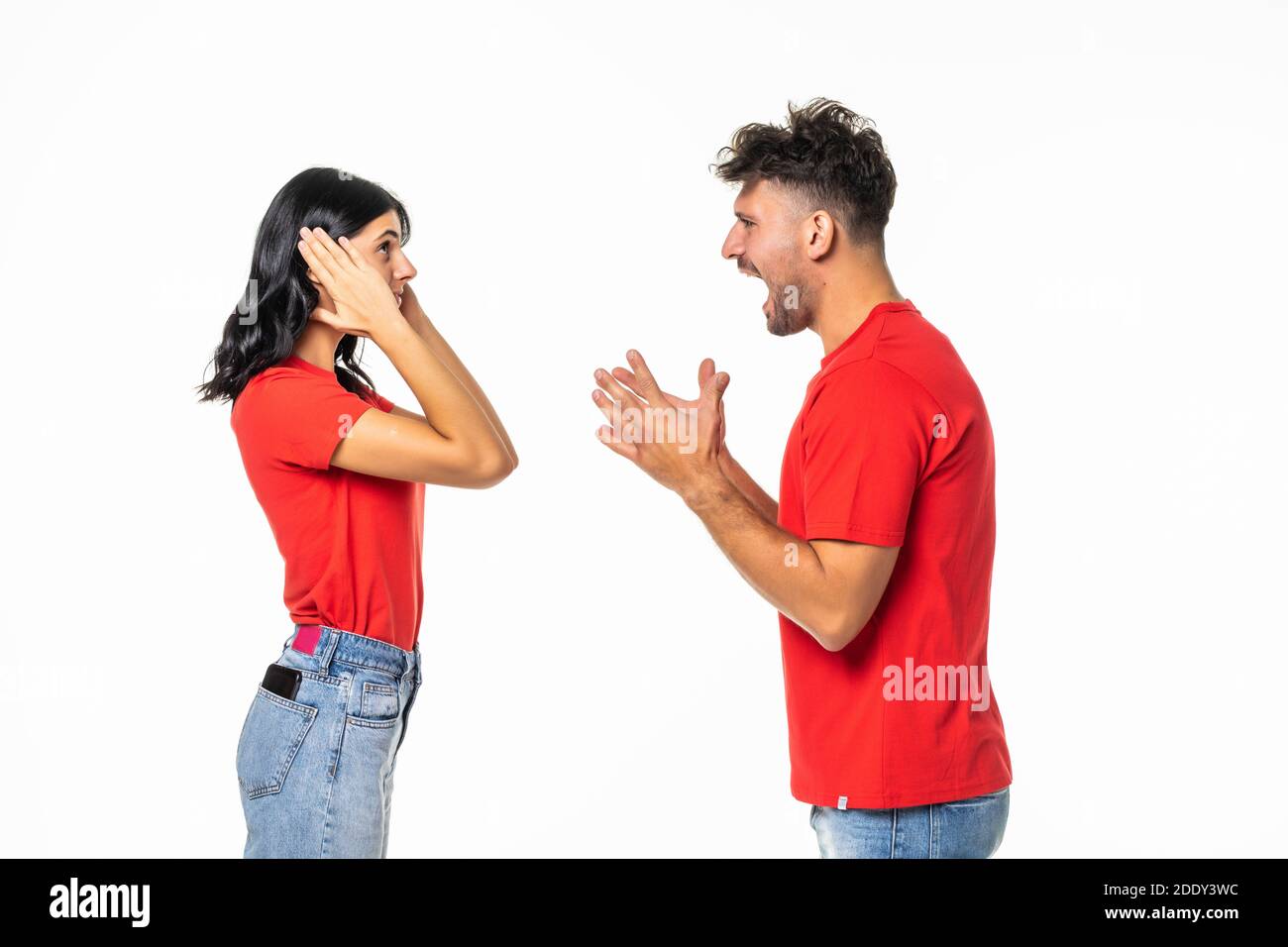 Angry couple shouting at each other on white background Stock Photo - Alamy