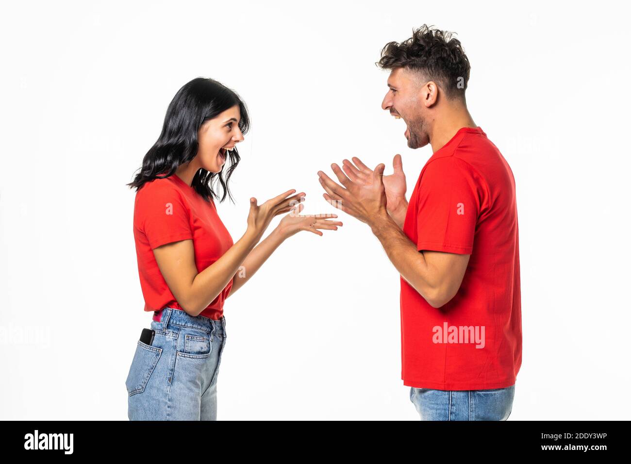Angry couple shouting at each other on white background Stock Photo - Alamy