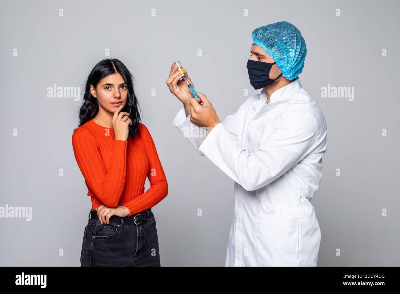 Covid-19 vaccination. Female patient getting vaccinated against ...