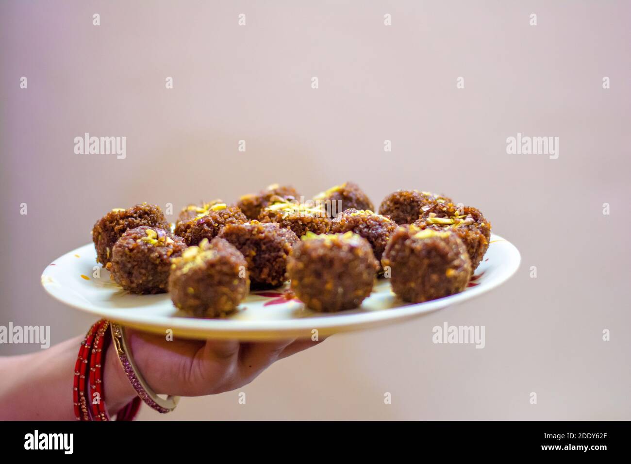 Fresh Homemade ladoo or laddu, made by bread crumbs with pistachio on ...