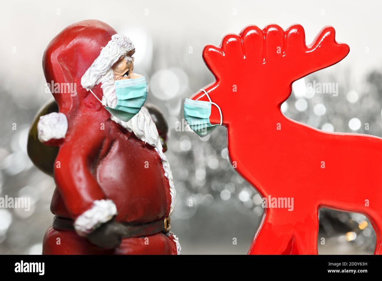 Santa Claus and reindeer figure wearing face masks, Corona Christmas ...