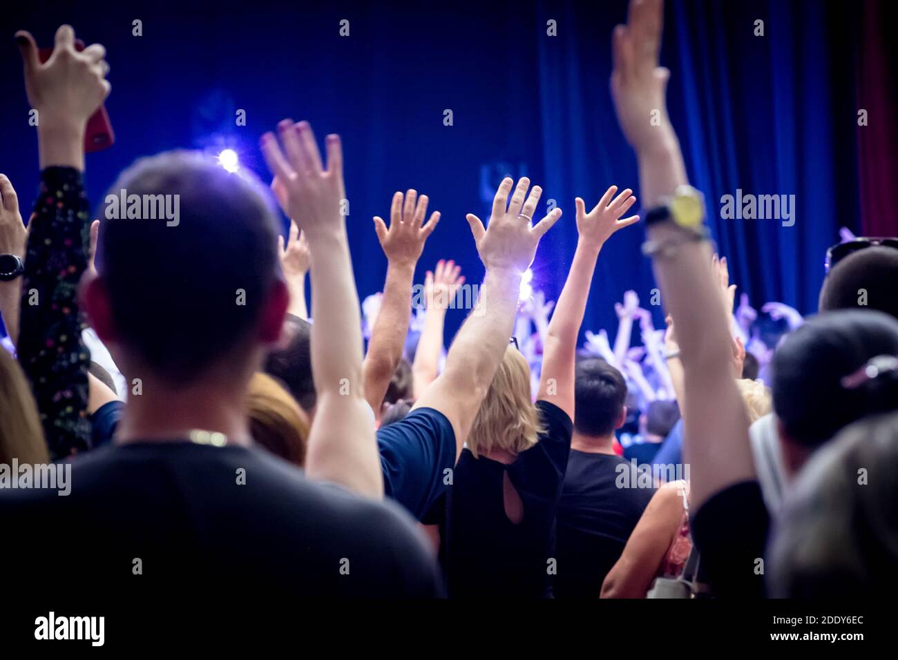 People raise their hands up Stock Photo - Alamy
