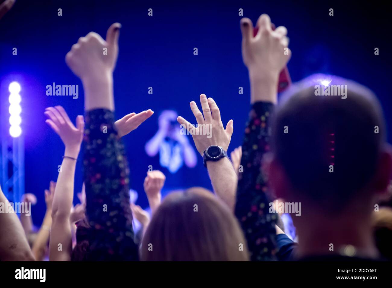 People raise their hands up Stock Photo - Alamy