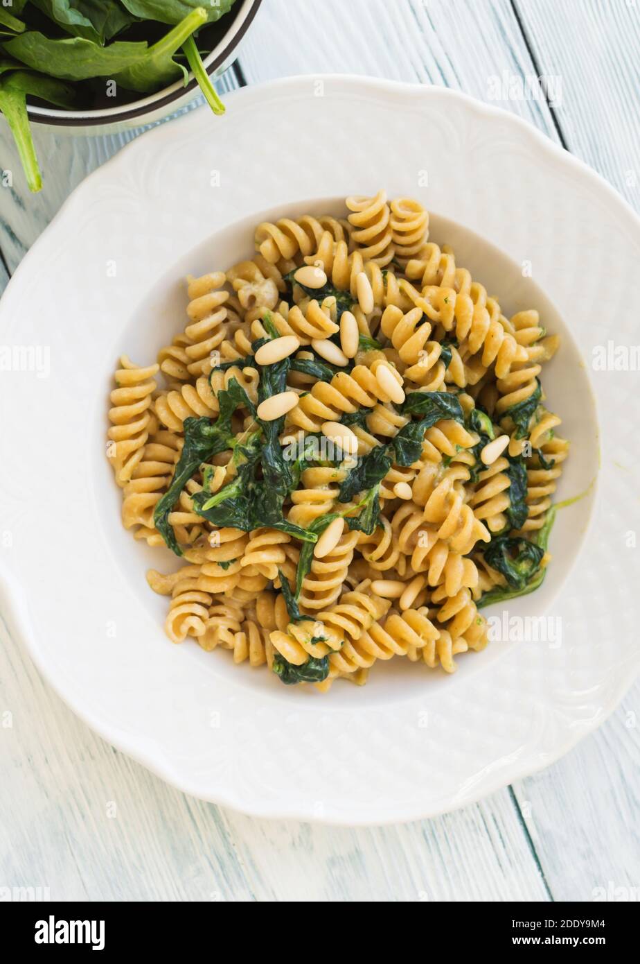 Whole grain pasta with spinach and pine nuts Stock Photo - Alamy
