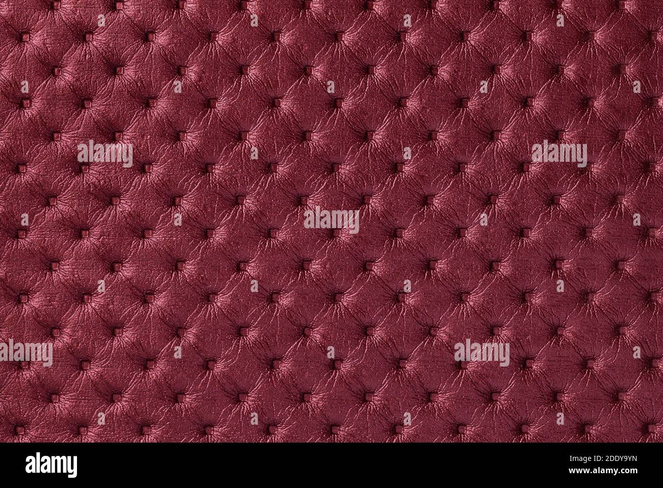 Texture of dark red leather background with capitone pattern, macro ...