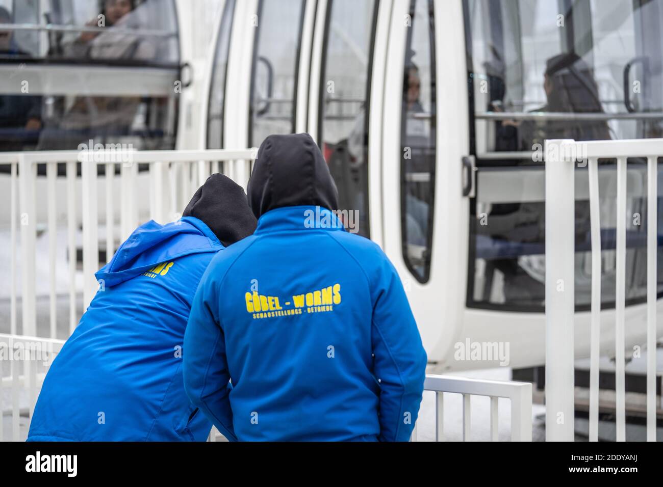 Employees of the amusement park monitor the correct filling by people ...