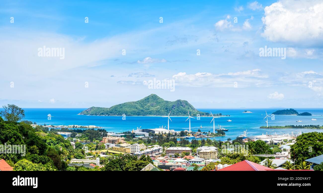 Victoria's port, Seychelles, with a view of St Anne Island with blue ...