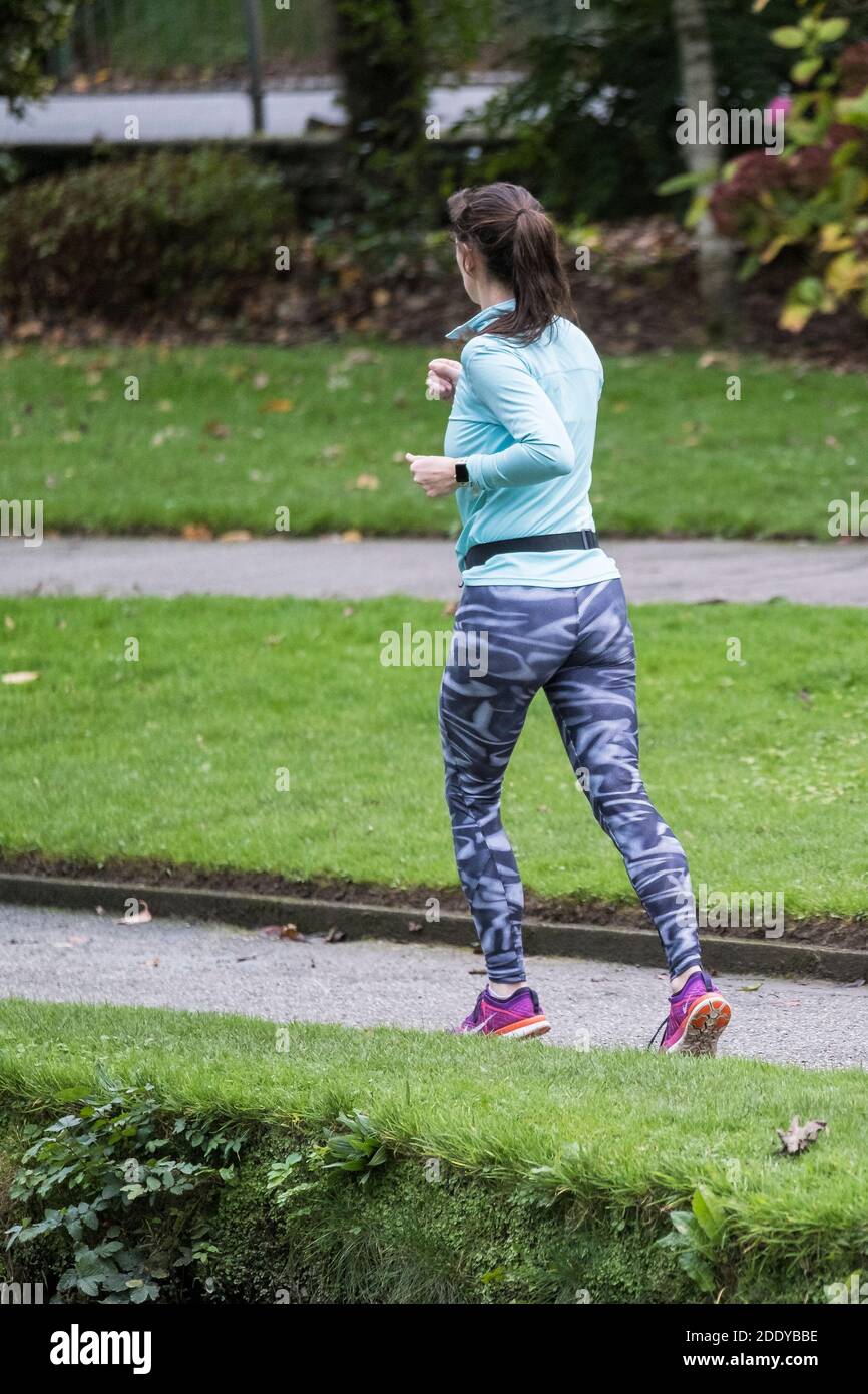 A female runner in Trenance Gardens in Newquay in Cornwall Stock Photo ...