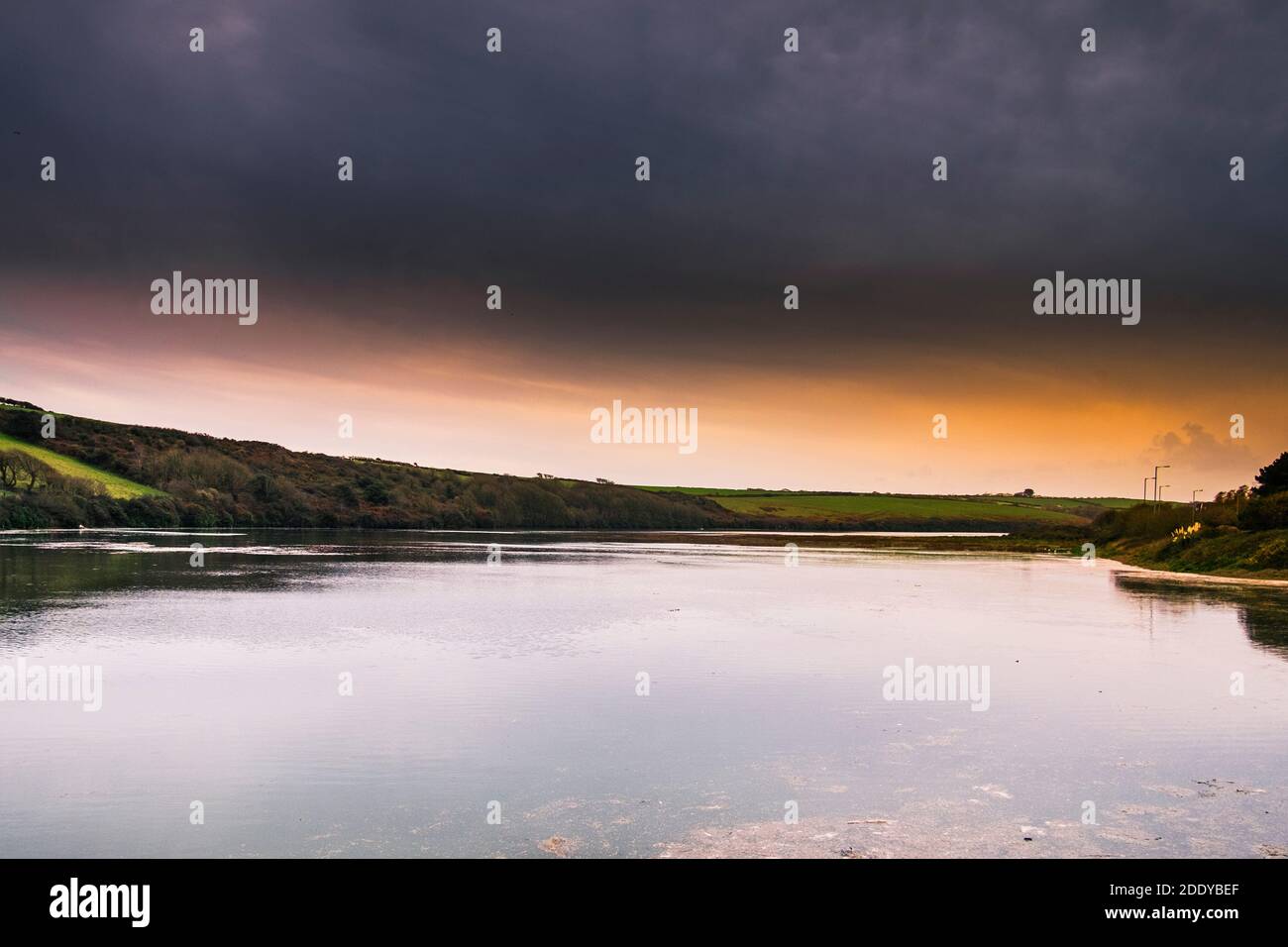 Evening light over the Gannel River at high tide in Newquay in Cornwall ...