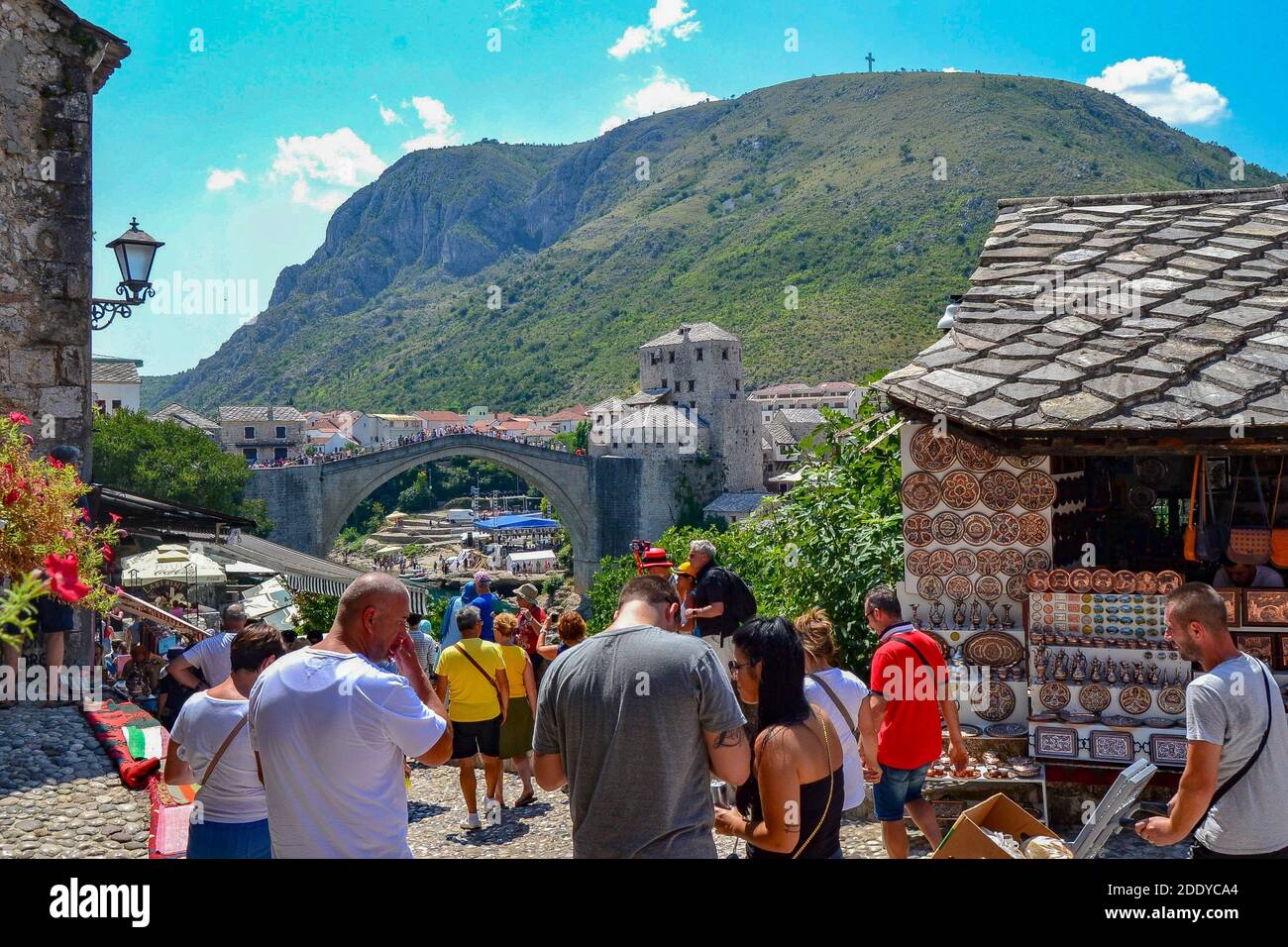 Mostar Bridge view from old and ottoman style city center. People and ...