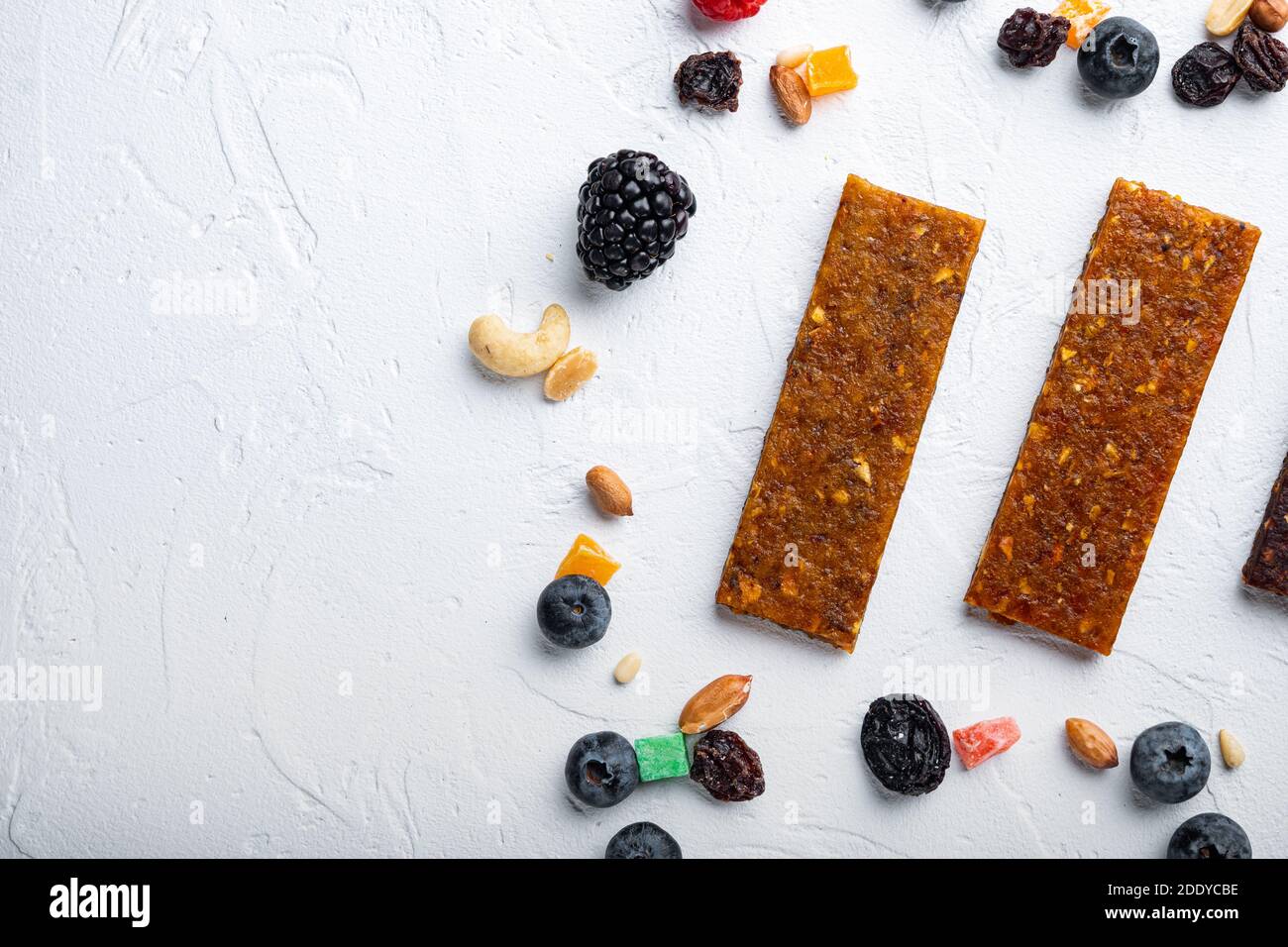 Healthy fitness energy bars with dried fruits and nuts, top view with ...