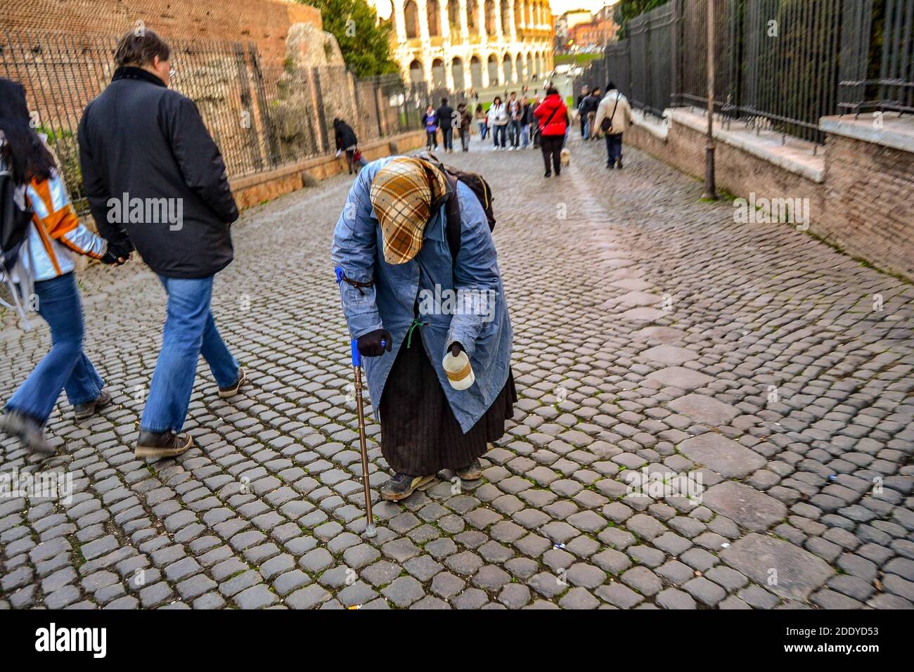 ITALY, ROME, 23.12.2011. Old woman beggar near the colosseum Rome Stock ...