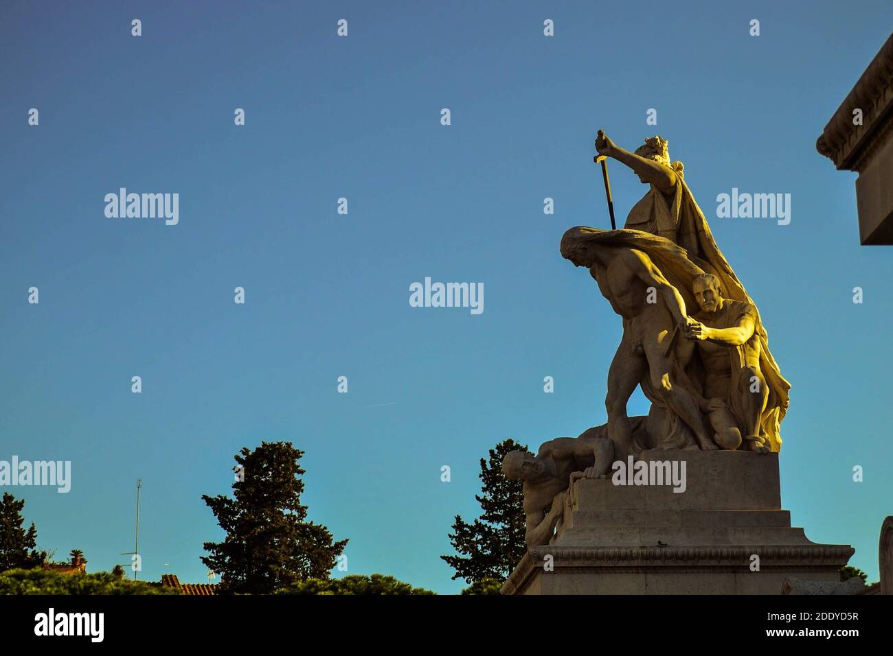 Magnificent statue in the Piazza Venezia. Fighting of men and sword ...